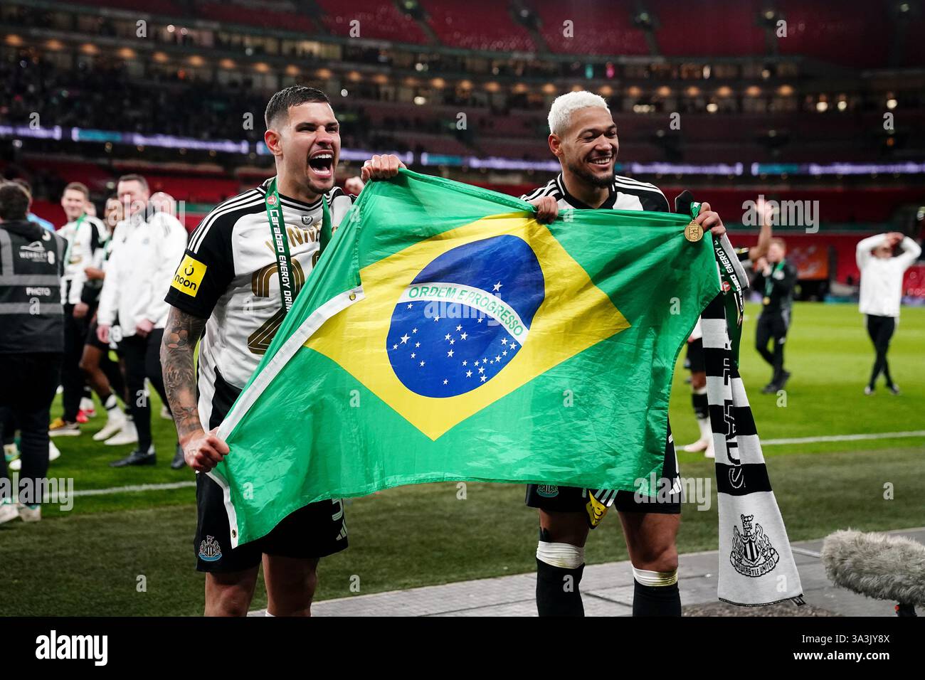 Newcastle United's Bruno Guimaraes (left) and Joelinton after winning ...