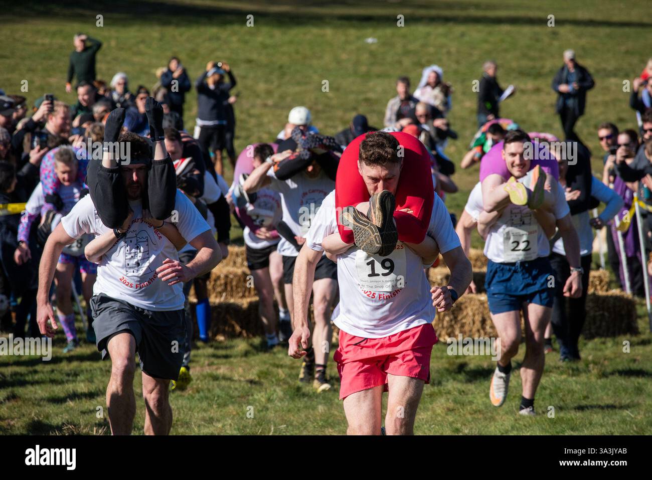 Late winning couple (centre) Stuart Johnson and Hattie Cronin lead the ...