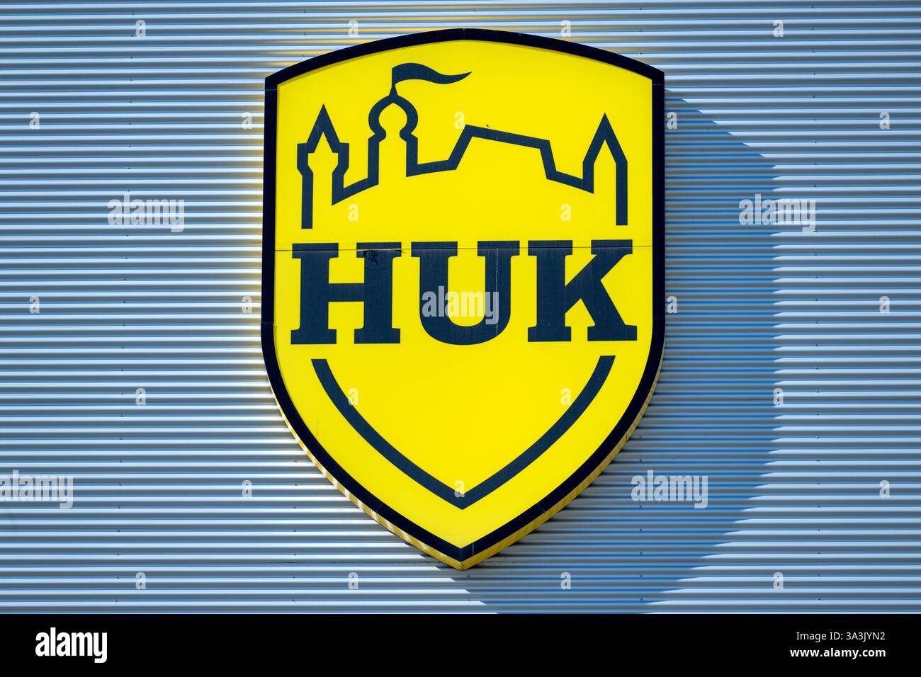 PRODUCTION - 16 March 2025, Bavaria, Coburg: An HUK Coburg logo casts ...