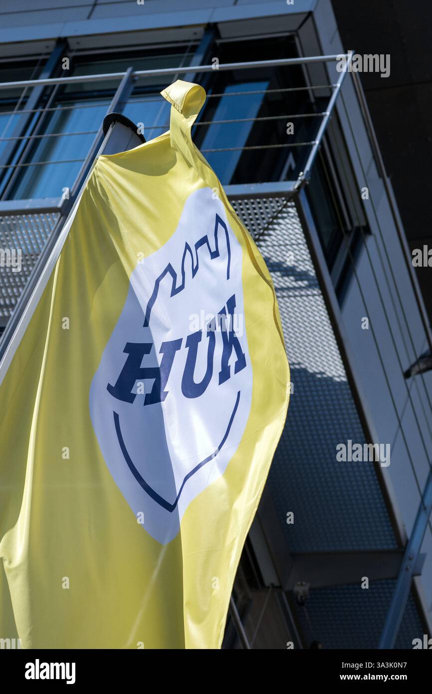 Coburg, Germany. 16th Mar, 2025. A flag with the new HUK Coburg logo ...