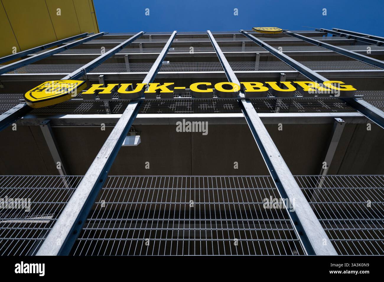 Coburg, Germany. 16th Mar, 2025. The HUK Coburg logo is emblazoned on a ...