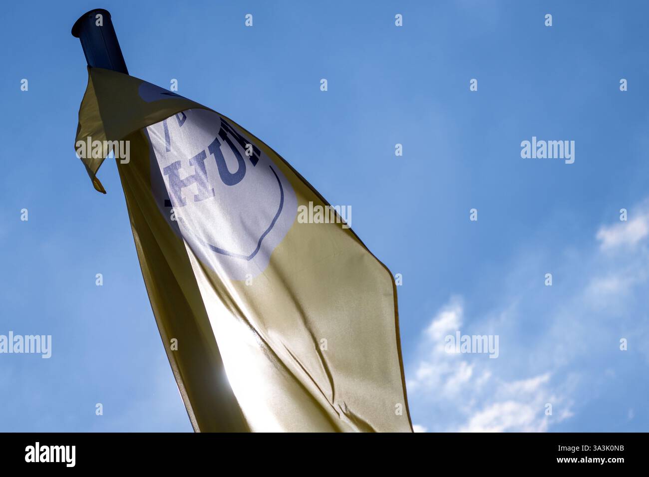 Coburg, Germany. 16th Mar, 2025. A flag with the new HUK Coburg logo ...