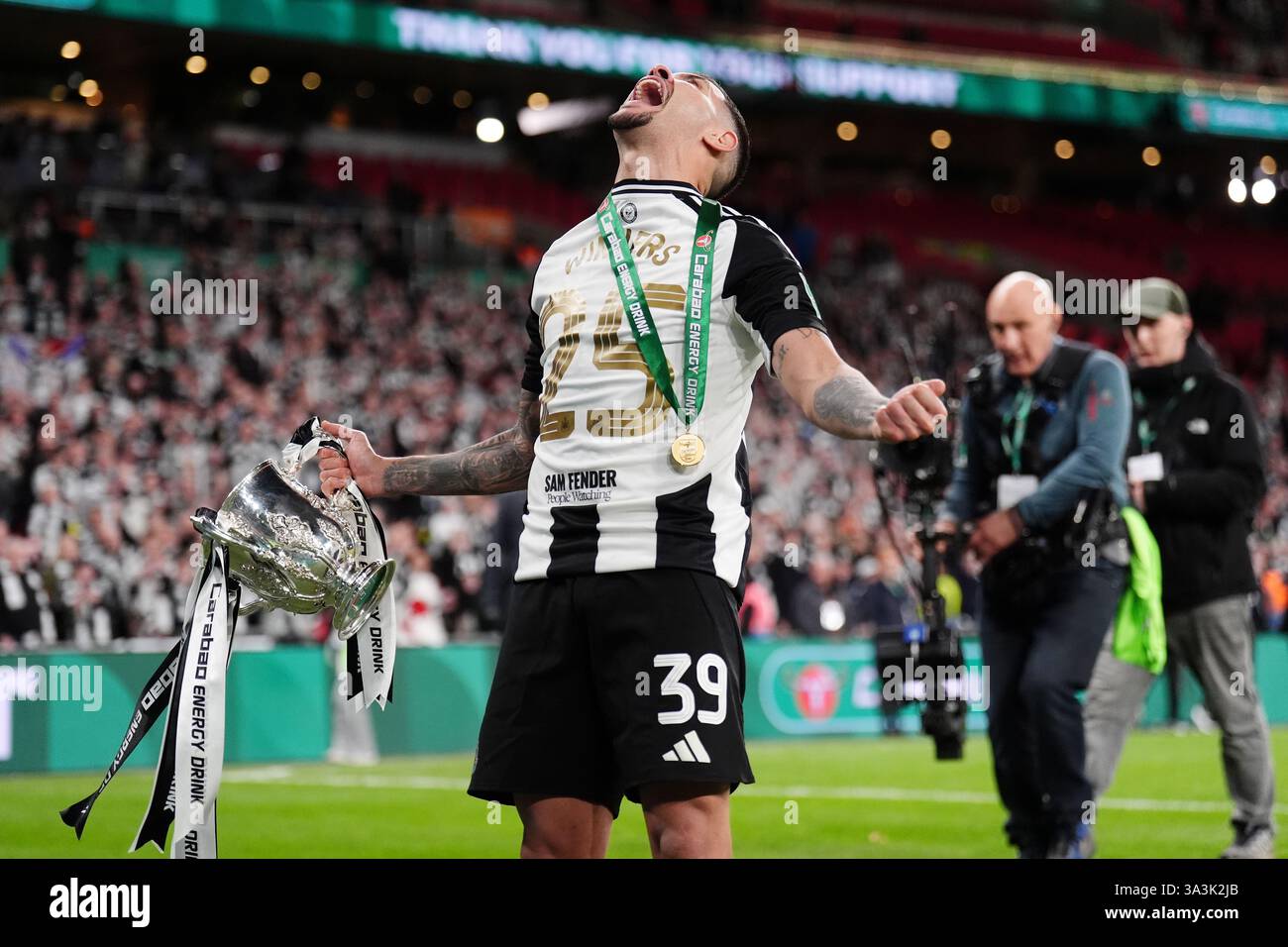Newcastle United's Bruno Guimaraes celebrates with the trophy after ...