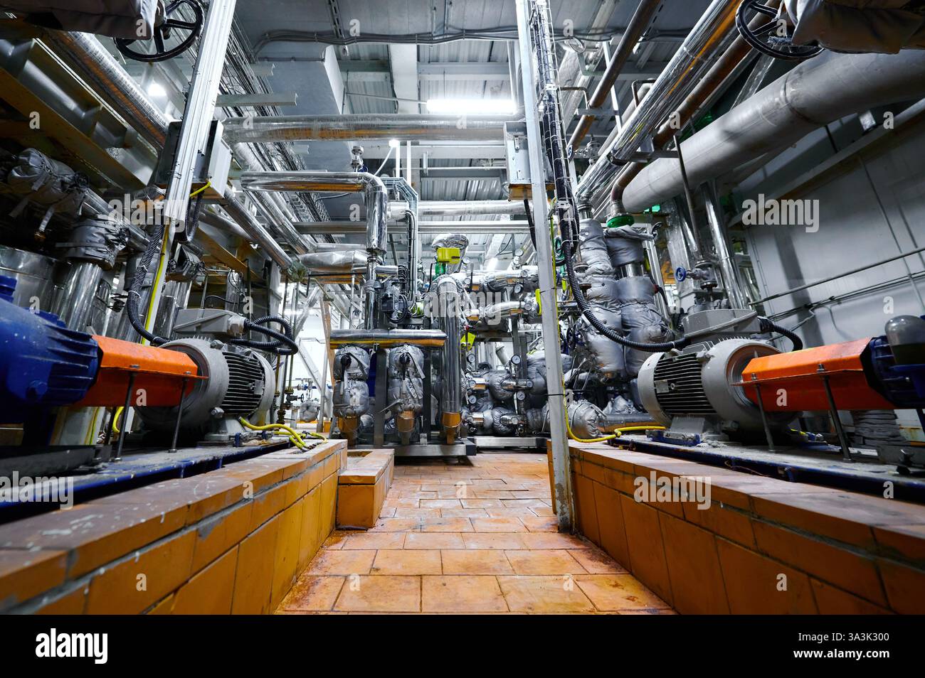 Inside a chemical plant showcasing intricate pipelines, valves, and ...