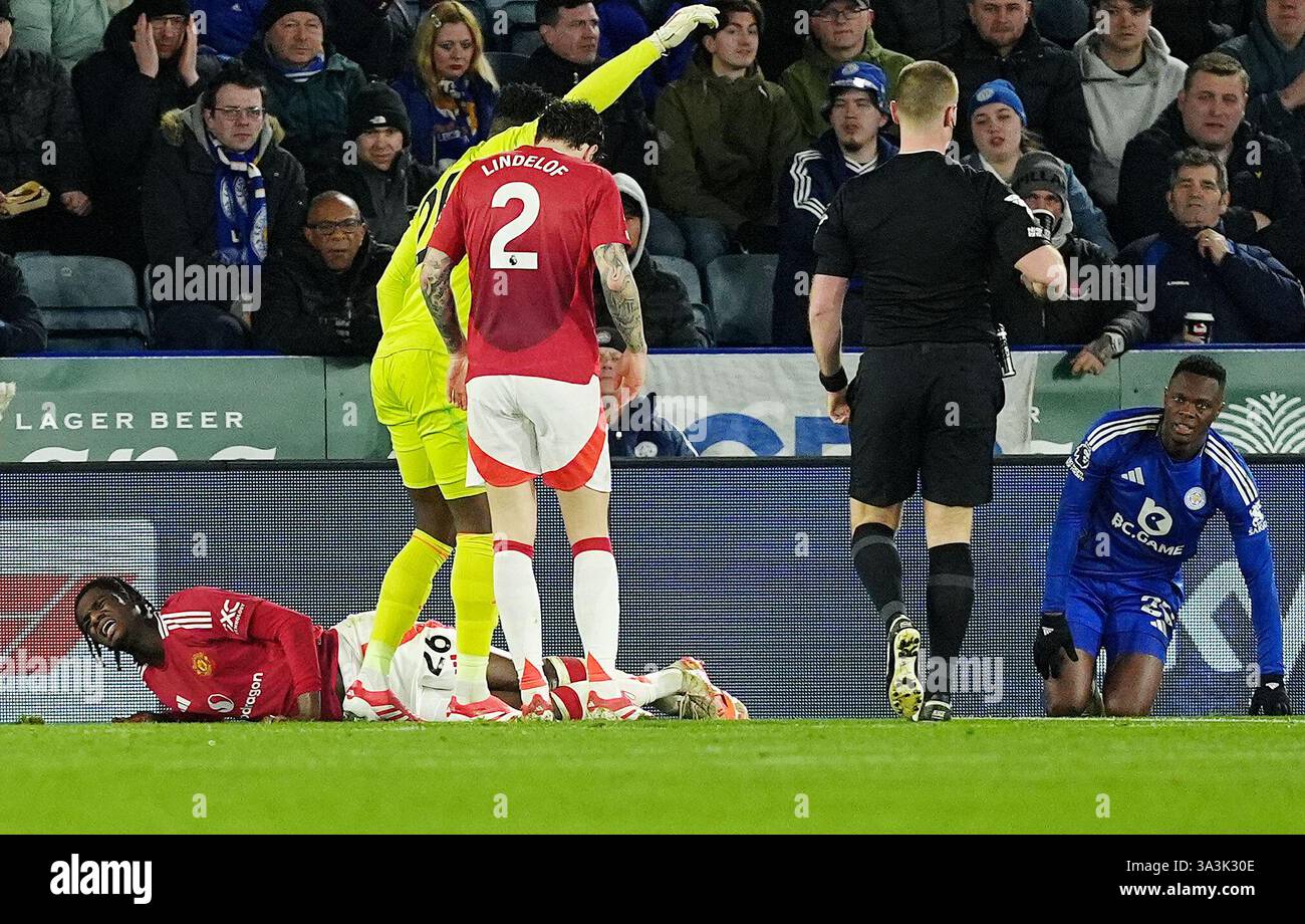 Manchester United's Ayden Heaven goes down injured during the Premier ...