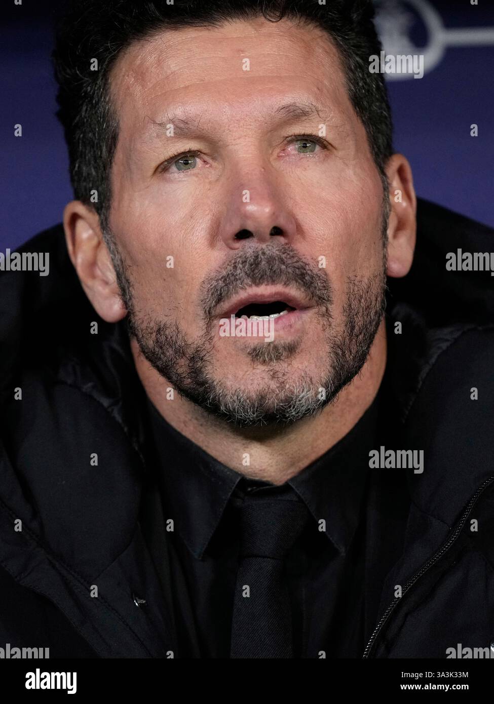 Atletico Madrid's head coach Diego Simeone sits on the bench prior to a ...