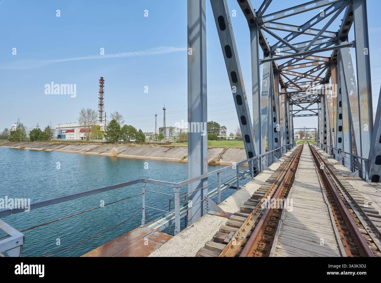 A railway bridge leading towards the Chernobyl Nuclear Power Plant, a ...