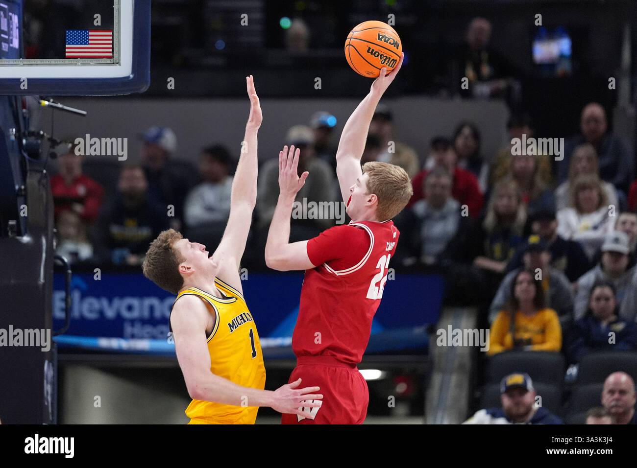 Wisconsin forward Steven Crowl (22) shoots on Michigan center Danny ...