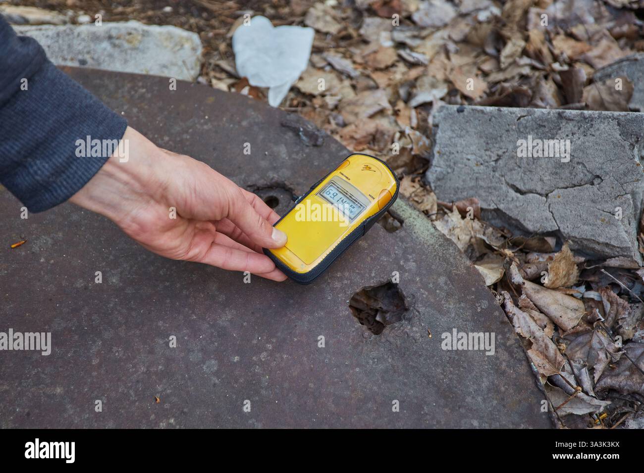 A dosimeter registers a significant increase in radiation levels near a ...