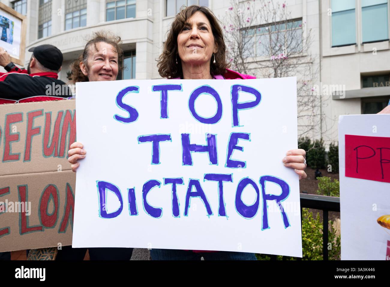 Washington, United States. 16th Mar, 2025. A person with a sign saying ...