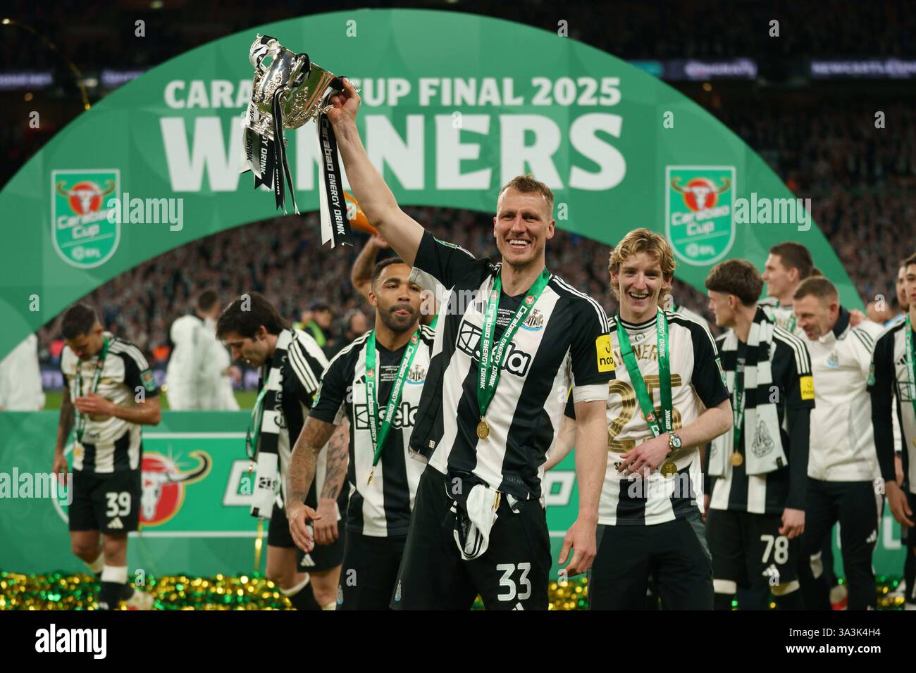 Dan Burn of Newcastle United holding the Carabao Cup after the Liverpool FC v Newcastle United ...