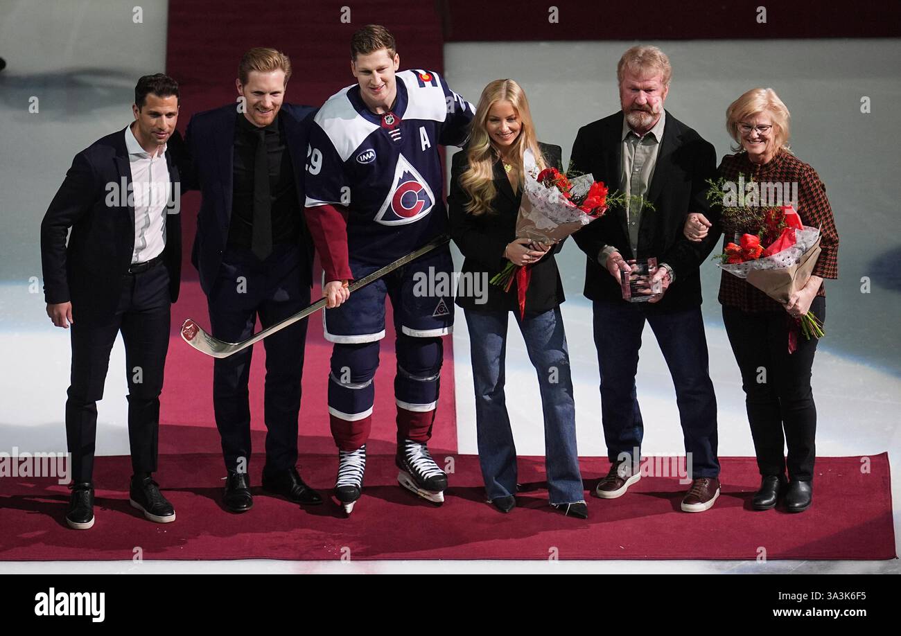 Colorado Avalanche center Nathan MacKinnon, third from left, shows the ...