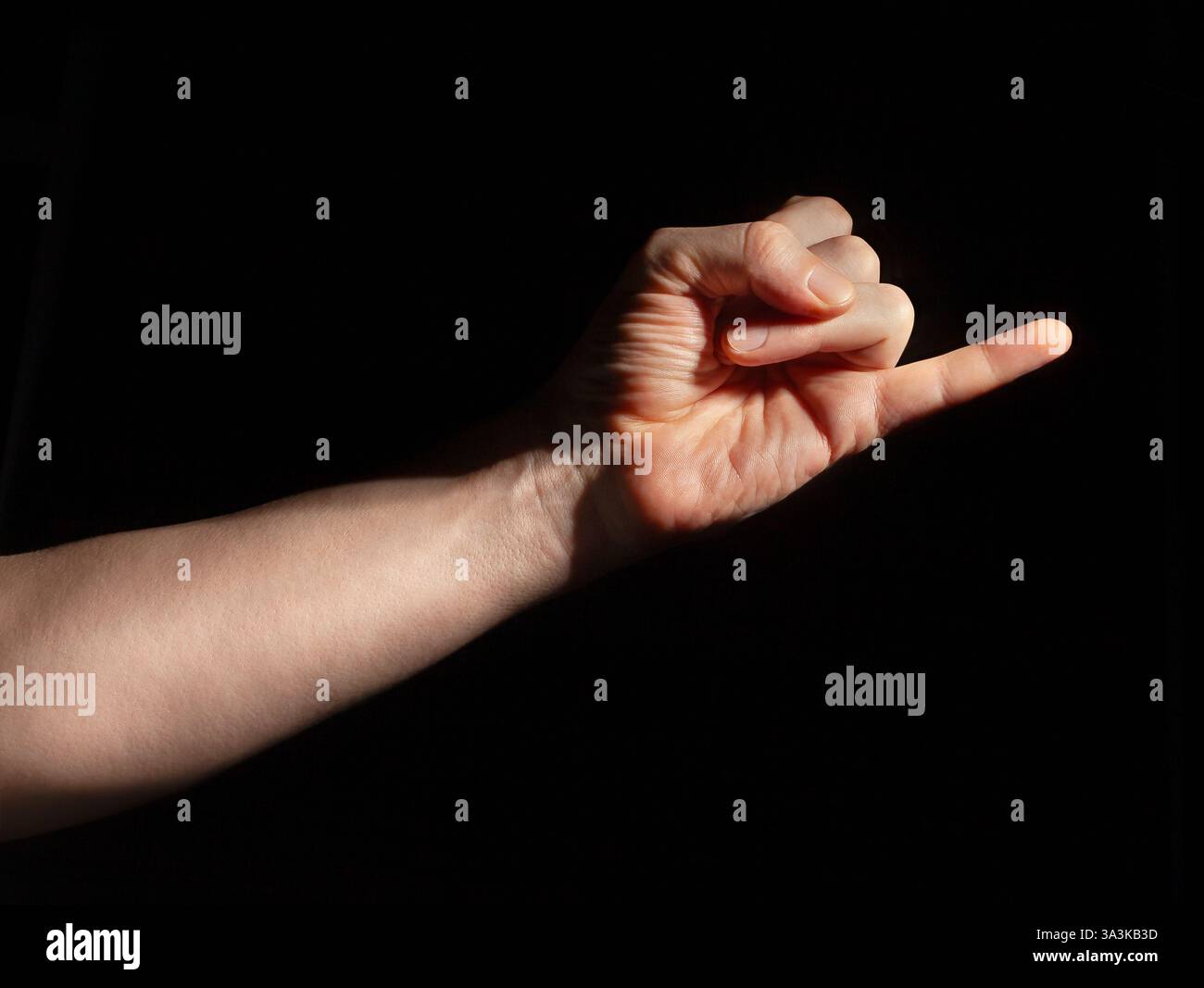 hand pinky finger gesture on black background Stock Photo - Alamy