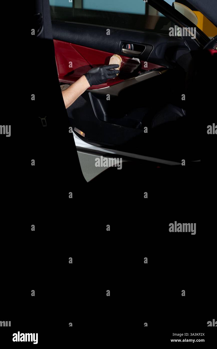 Process of restoration car door plastic. Brushing car door panel ...