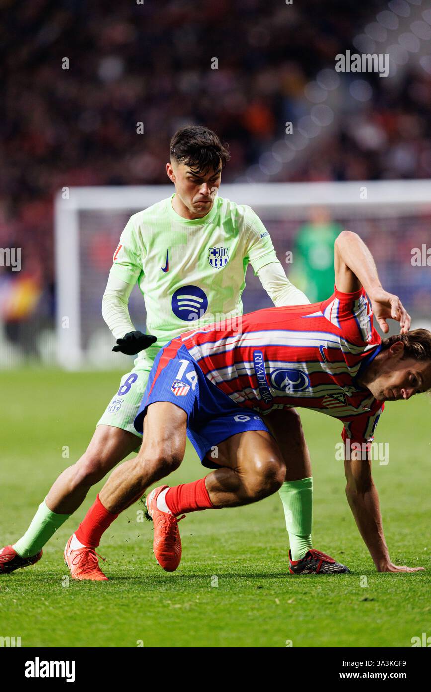 Madrid, Spain. 16th Mar 2025. Pedri (FC Barcelona) and Marcos Llorente ...