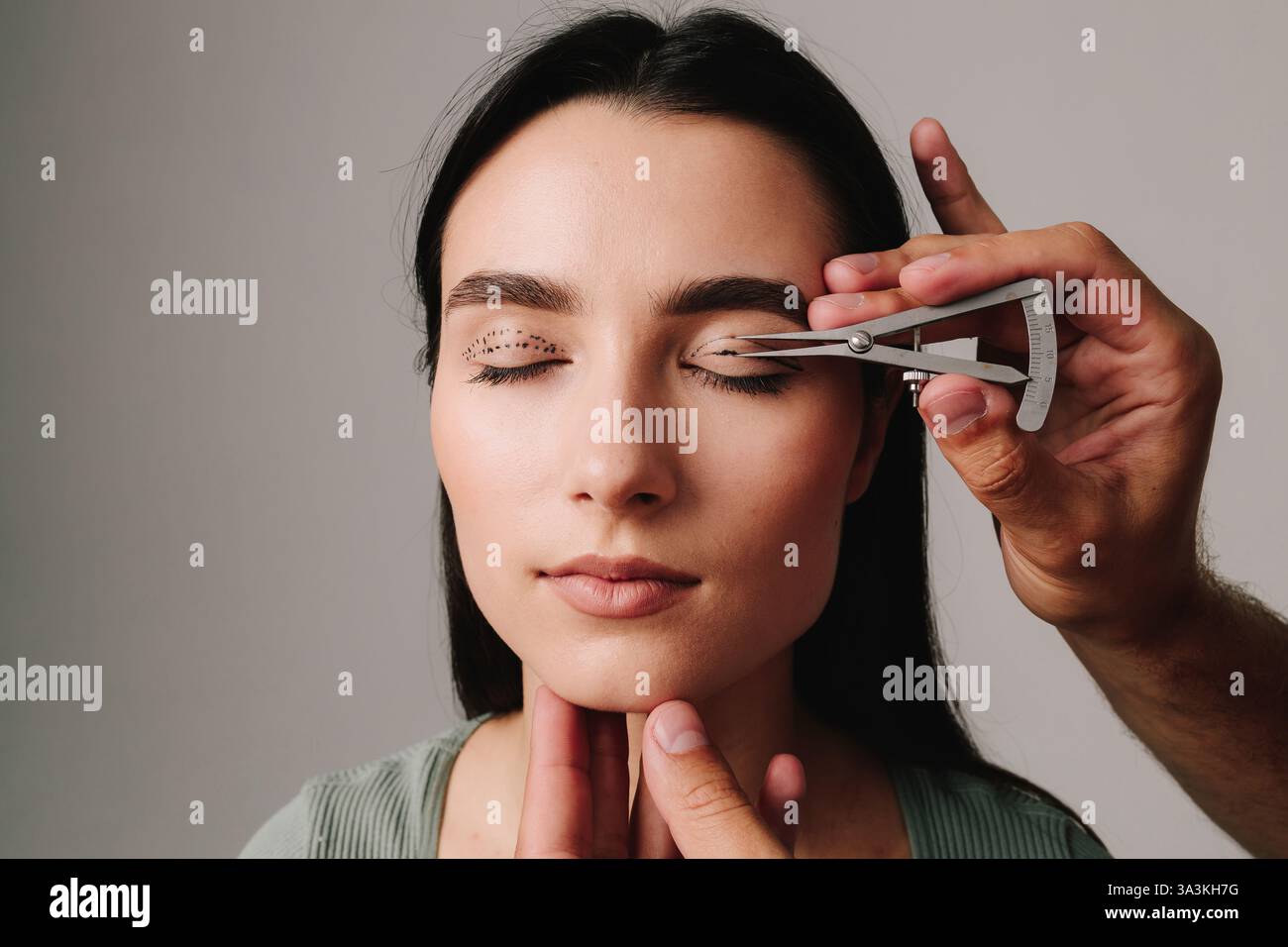 Castroviejo caliper to draw symmetrical contour for eyelid surgery ...