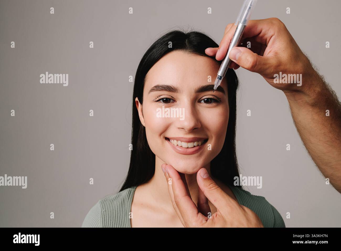 Upper Blepharoplasty. Surgeon is drawing marking lines on eyelid of ...