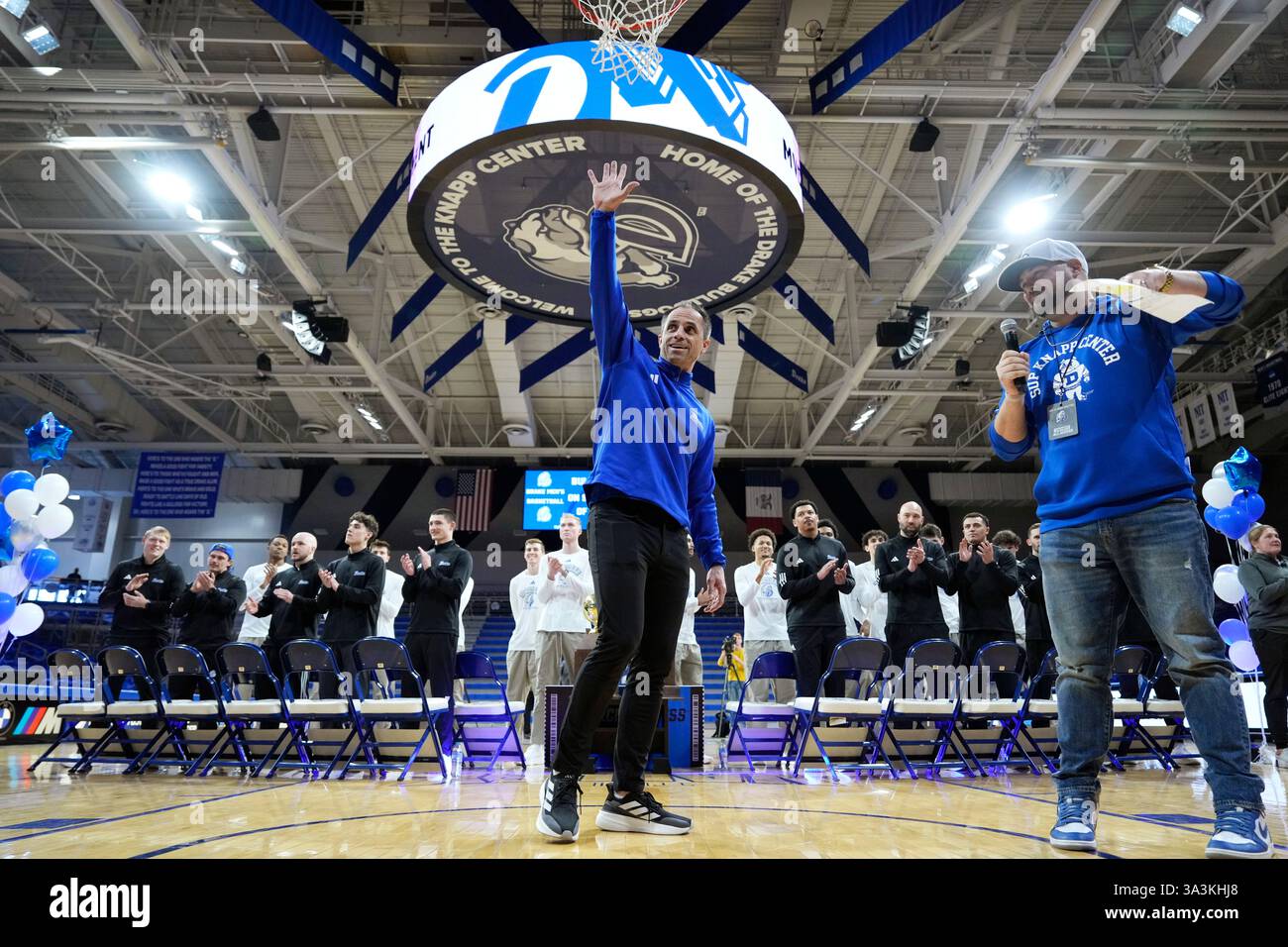 Drake head coach Ben McCollum waves to fans before watching the ...