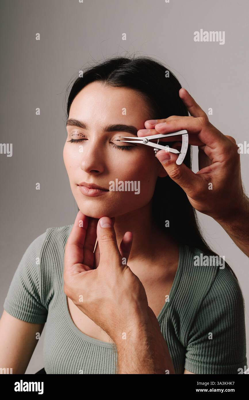 Castroviejo caliper to draw symmetrical contour for eyelid surgery ...