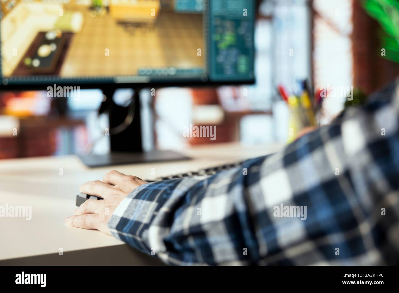 Interior designer uses 3D modeling program, selecting furniture from ...