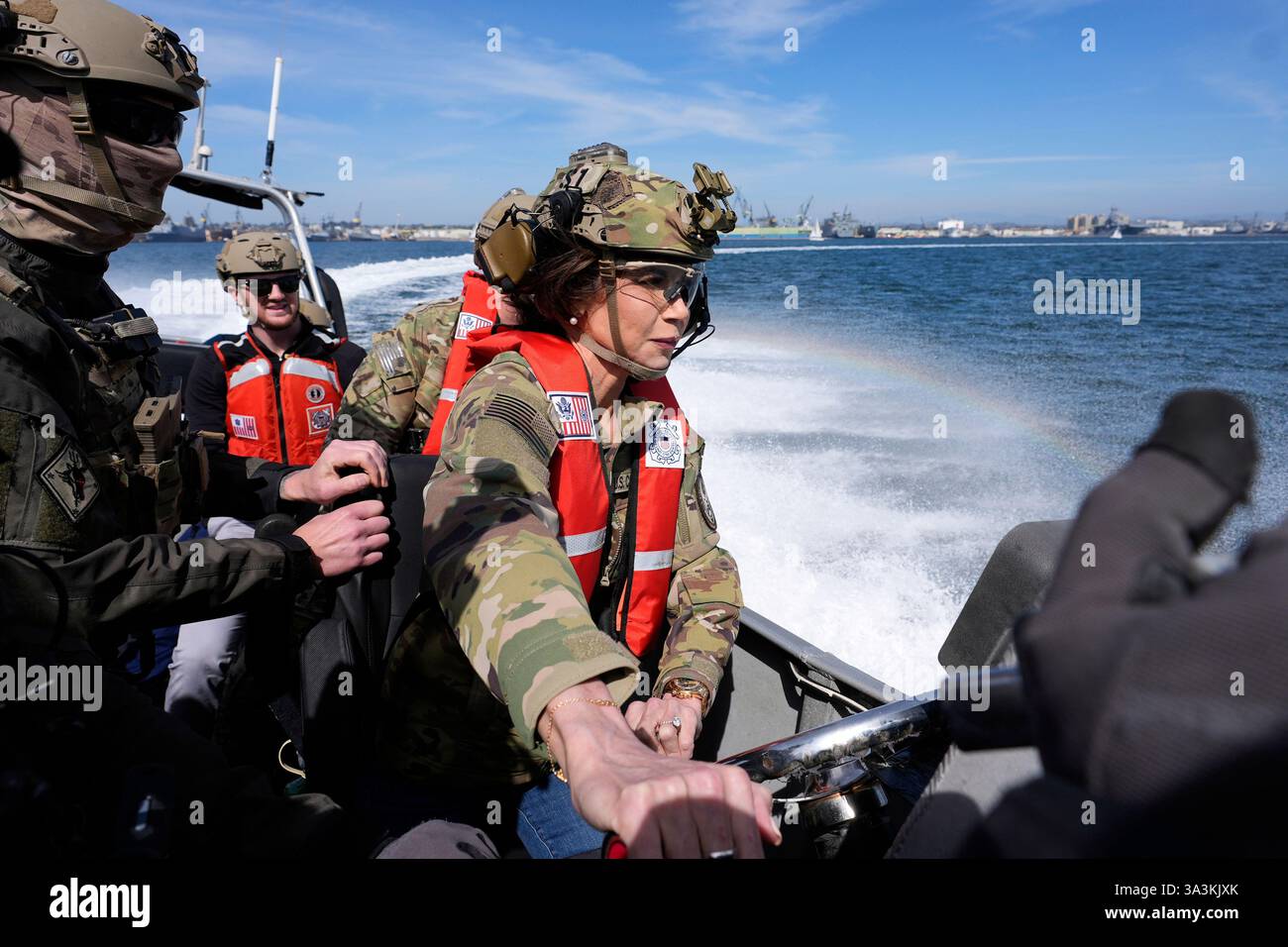 Homeland Security Secretary Kristi Noem, right, pilots a U.S. Coast ...