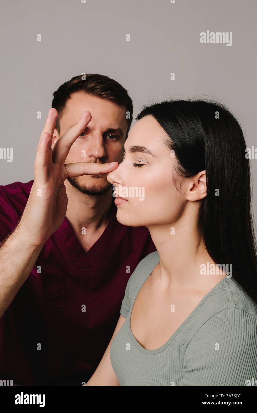 Rhinoplasty to improve appearance of nose. Woman is going through ...