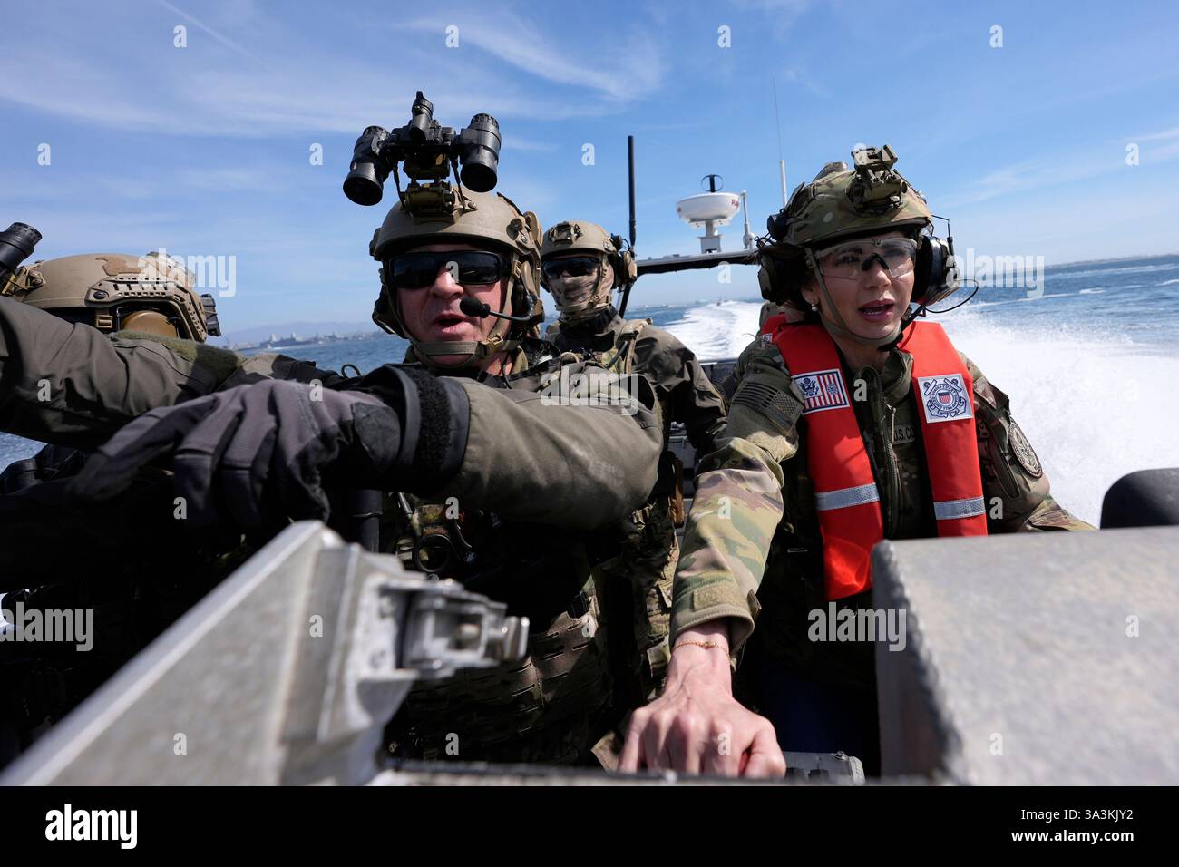 Homeland Security Secretary Kristi Noem, right, pilots a U.S. Coast ...
