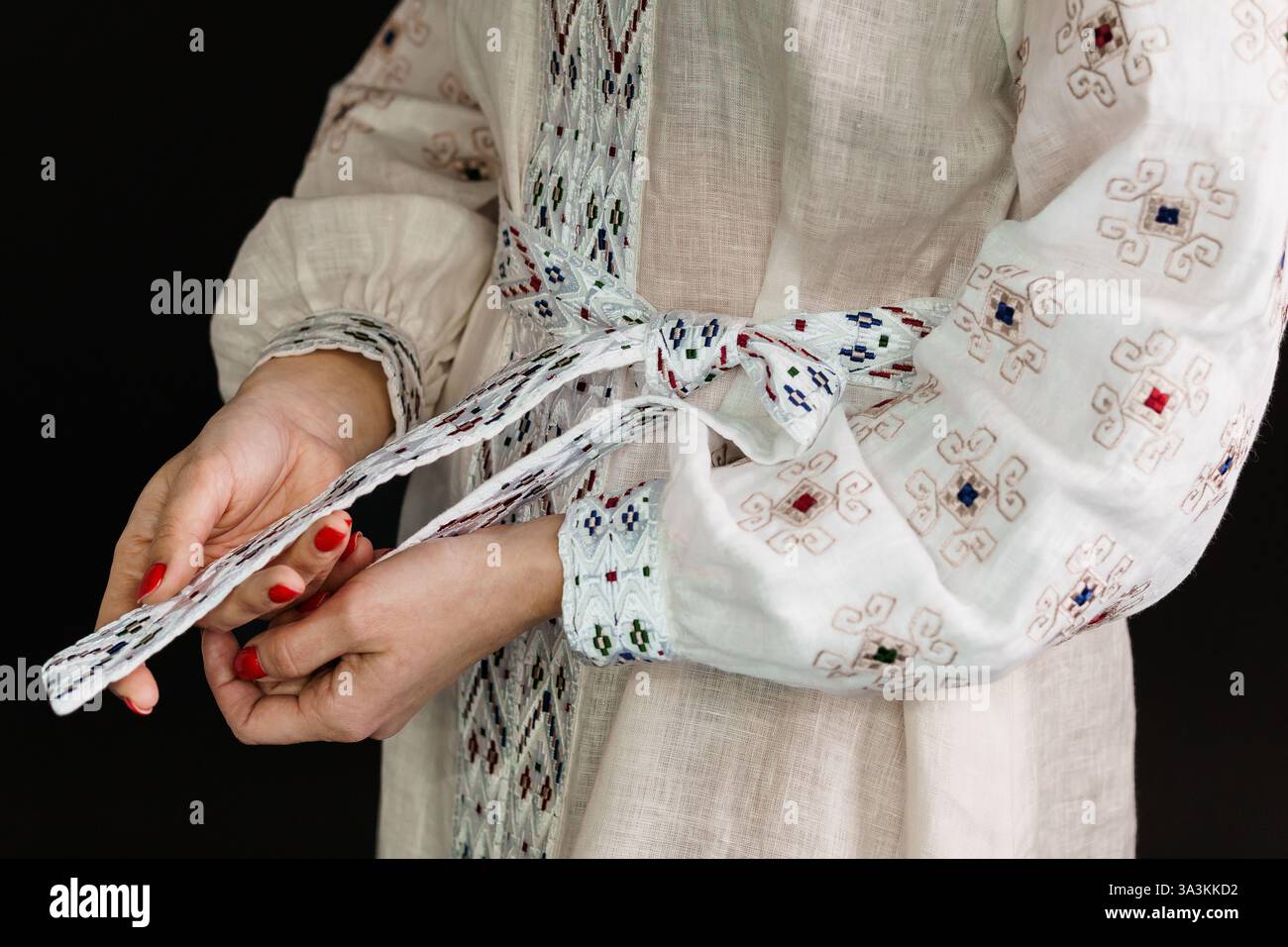 Close up woman tying belt hi-res stock photography and images - Alamy