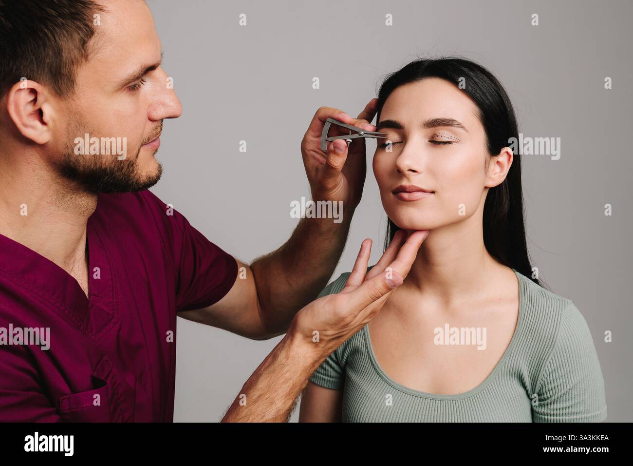 Castroviejo caliper to draw symmetrical contour for eyelid surgery ...