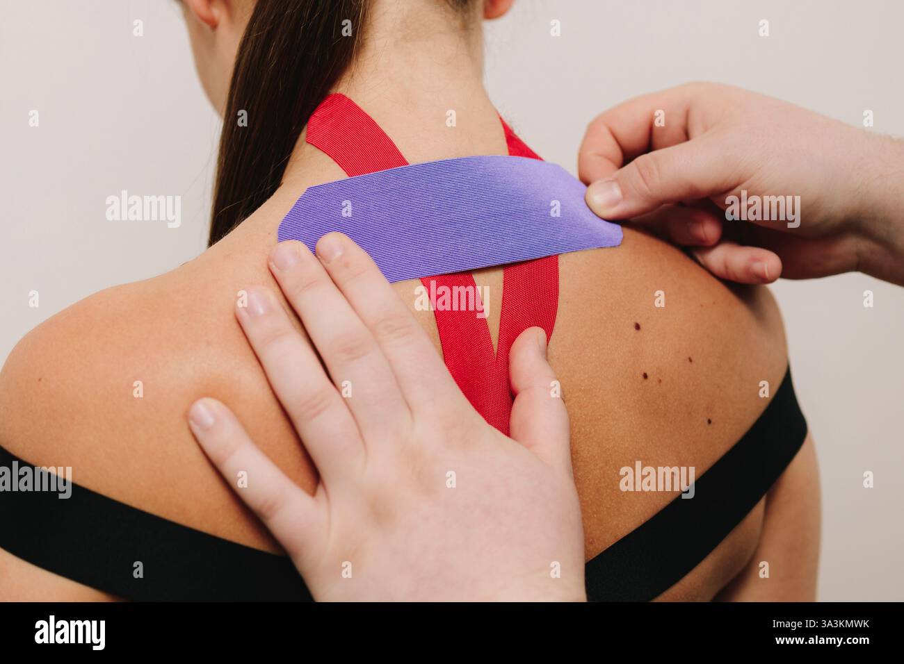 Medical tape. Healing from lymphedema with K-tapes. Doctor is applying ...