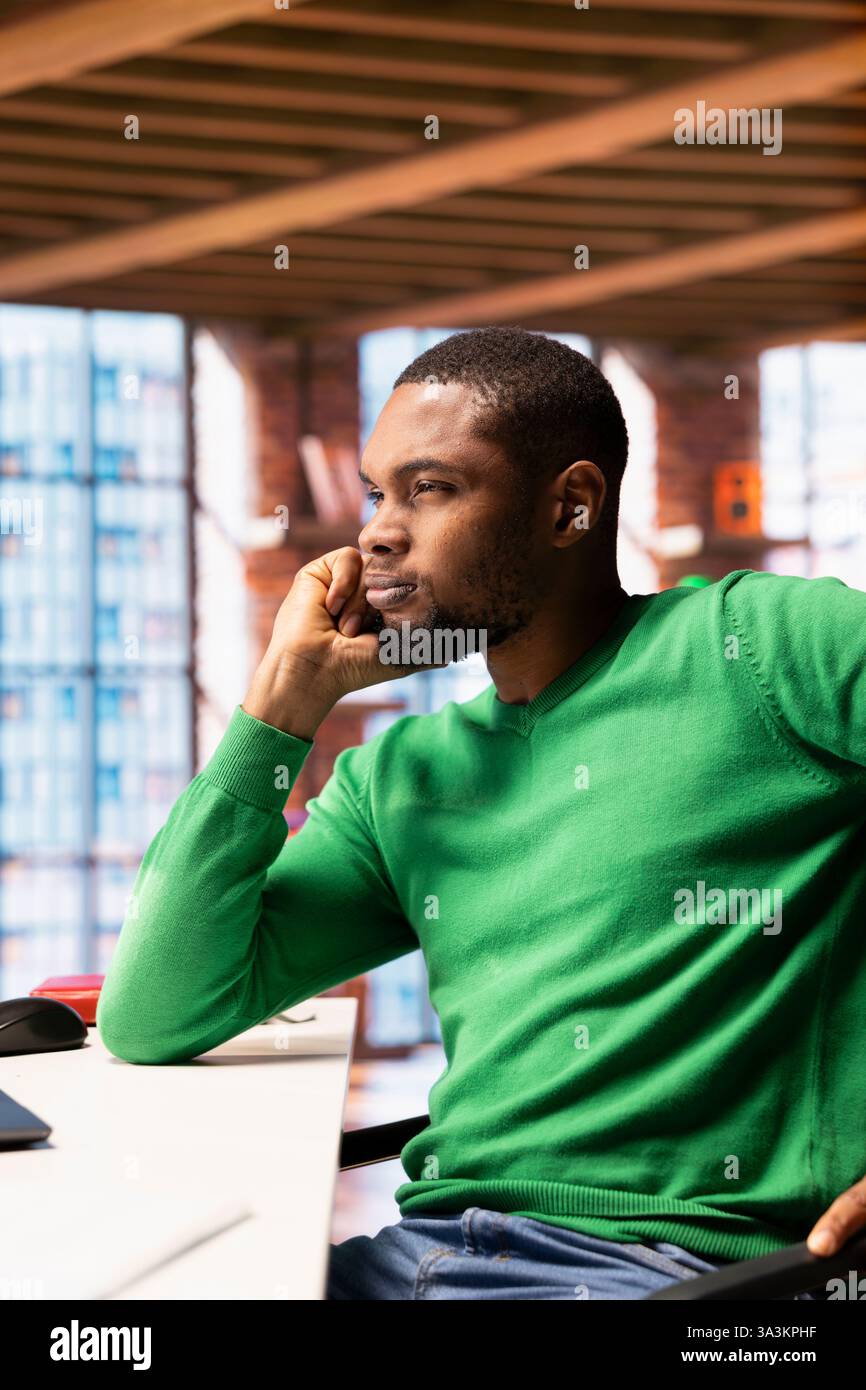 Man having hard time coming up with ideas for work project at home ...