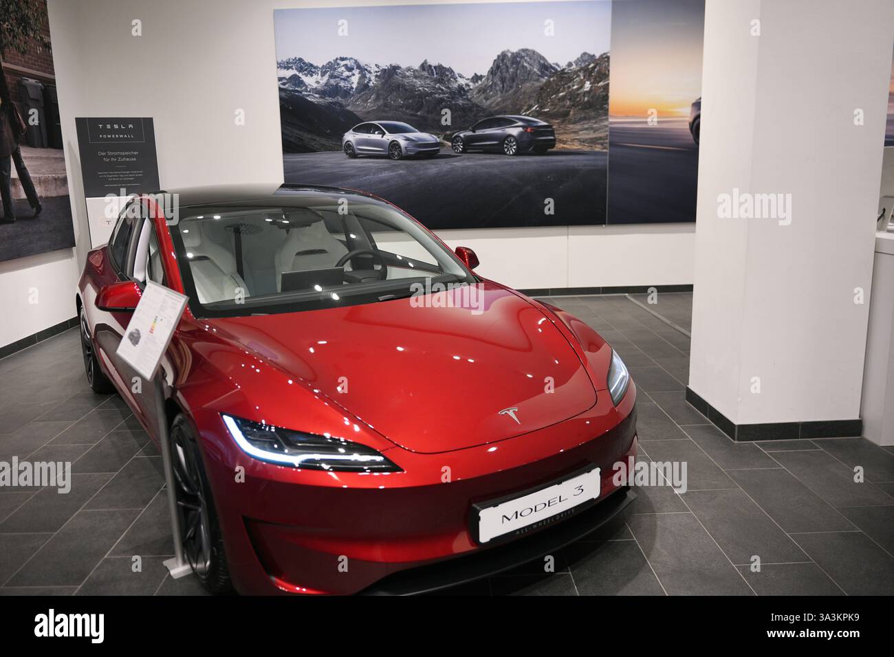 Berlin, Germany 02.13.2025 Red Tesla Model 3 in showroom display Stock ...