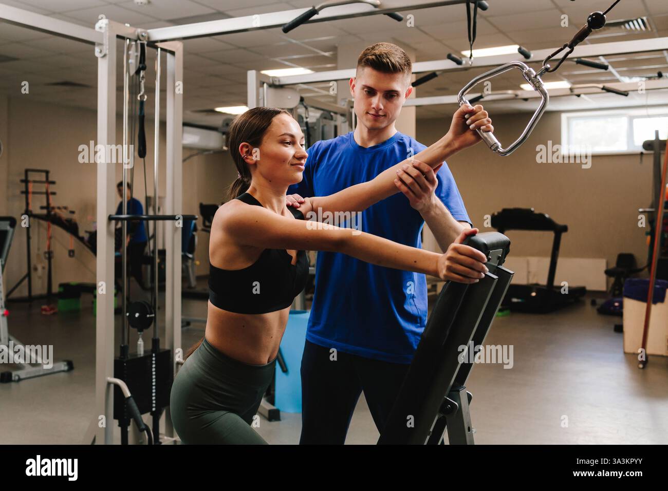 Female patient is doing kinesitherapy yo improve physical conditioning ...