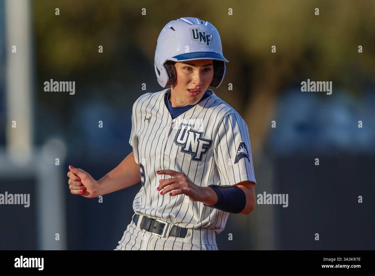 North Florida outfielder Chloe Culp (3) leads off from first base ...