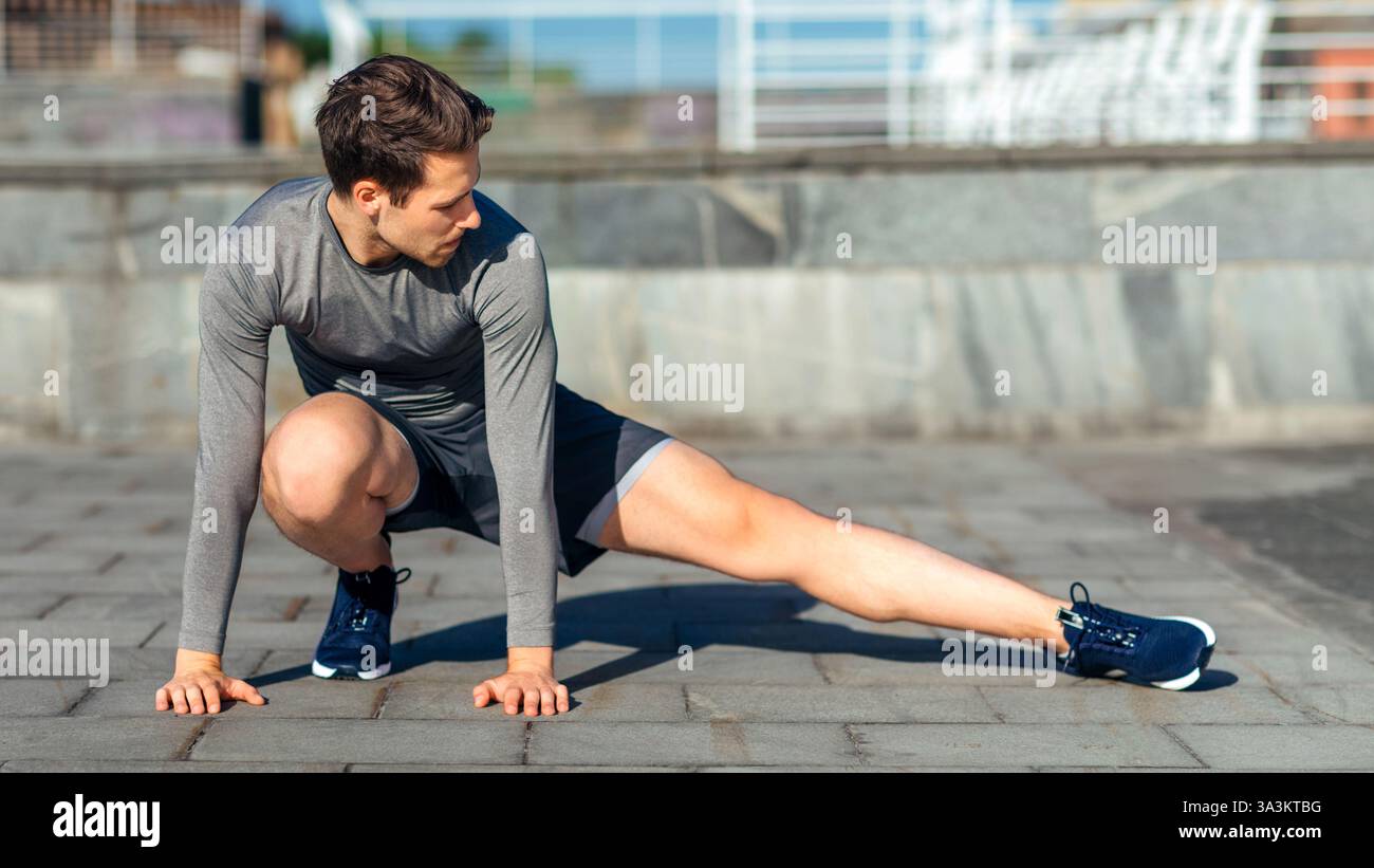 Healthy lifestyle, warm up and jogging. Guy doing exercises before ...