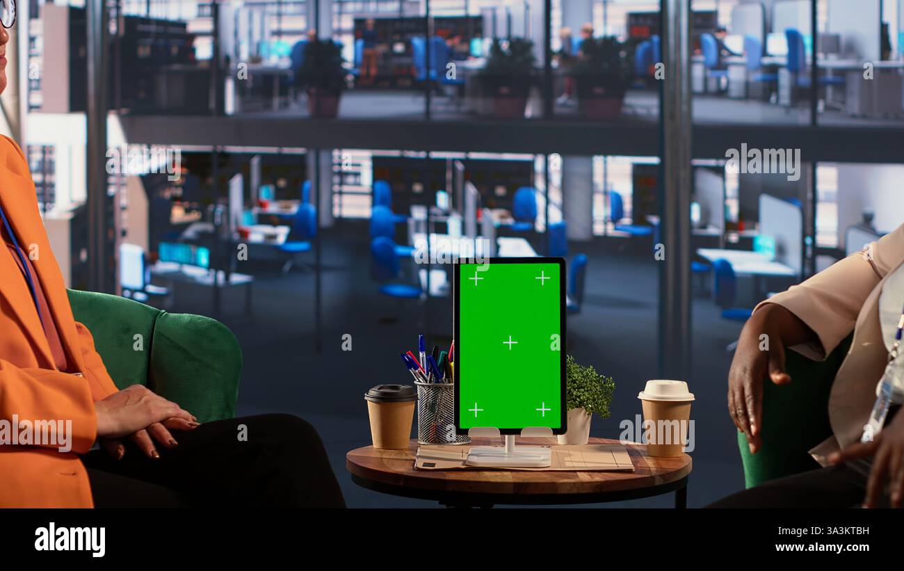 Group of CEOs using chroma key screen on tablet in a meeting ...