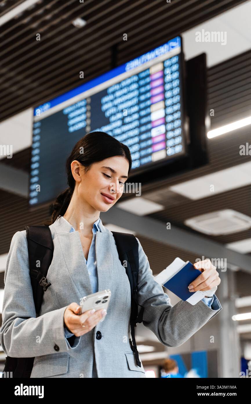 Girl looks flight ticket hi-res stock photography and images - Alamy
