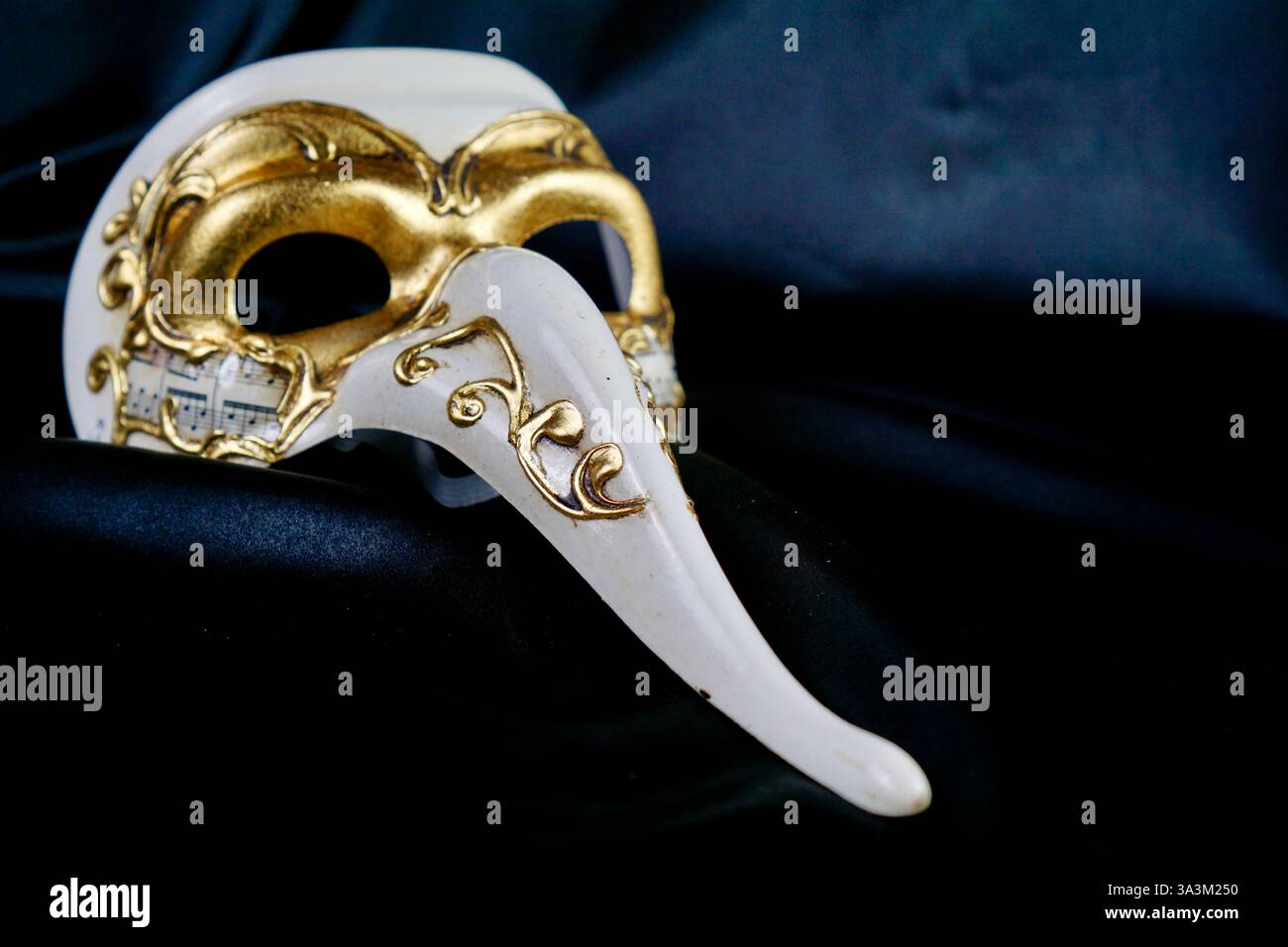 A detailed venetian doctor mask placed on a black background ...