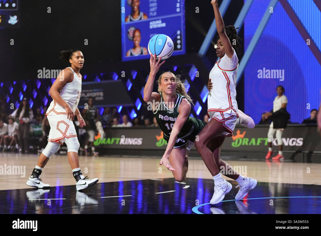 Rose wing Lexie Hull attempts a shot defended by Laces guard Tiffany ...