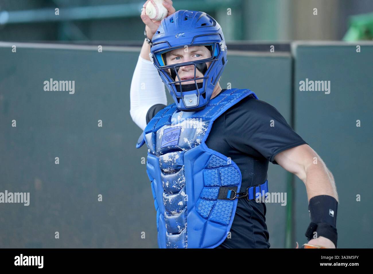 Catcher Peter Mershon (3) of the Eastside Eagles warms up the pitcher ...