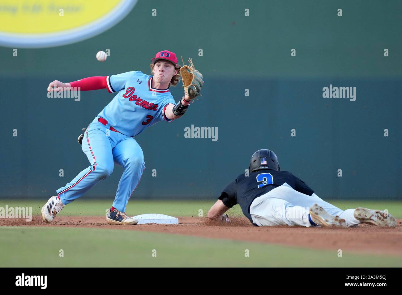 Shortstop Colton Earnhardt (3) of the Dorman Cavaliers takes the throw ...