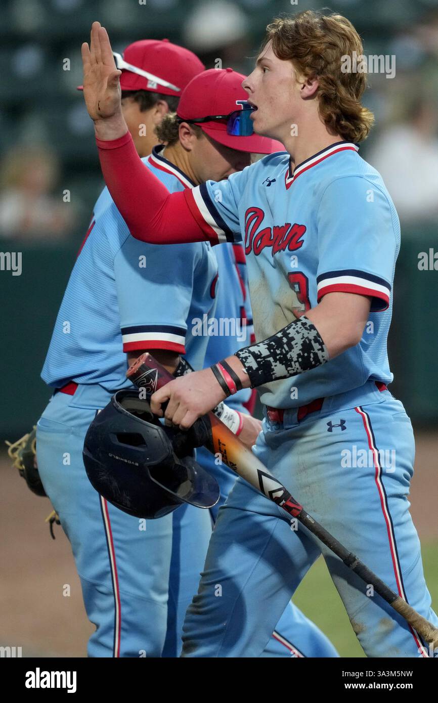 Shortstop Colton Earnhardt (3) of the Dorman Cavaliers is greeted after ...