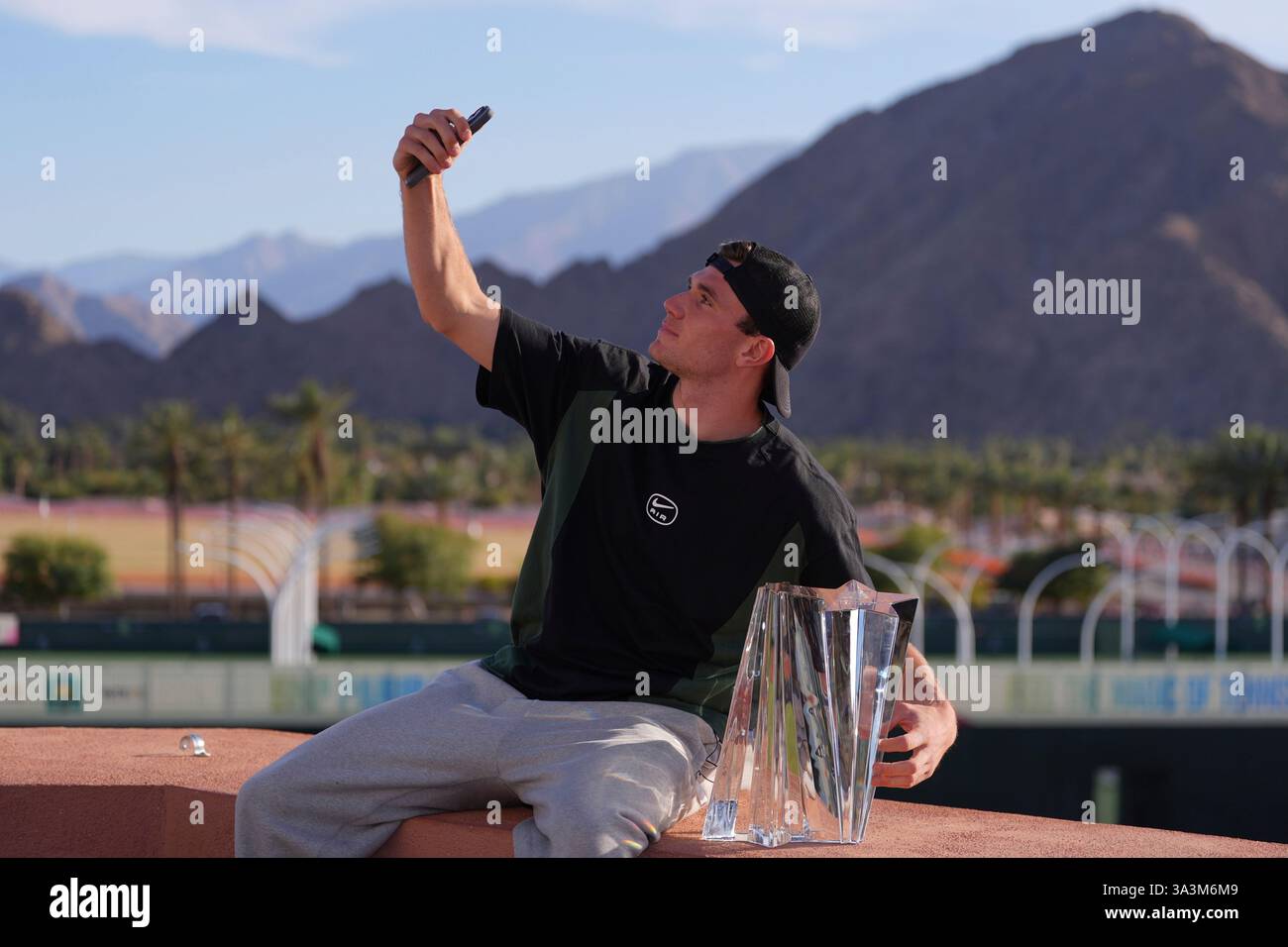 Jack Draper, of Great Britain, takes a selfie with his trophy after ...