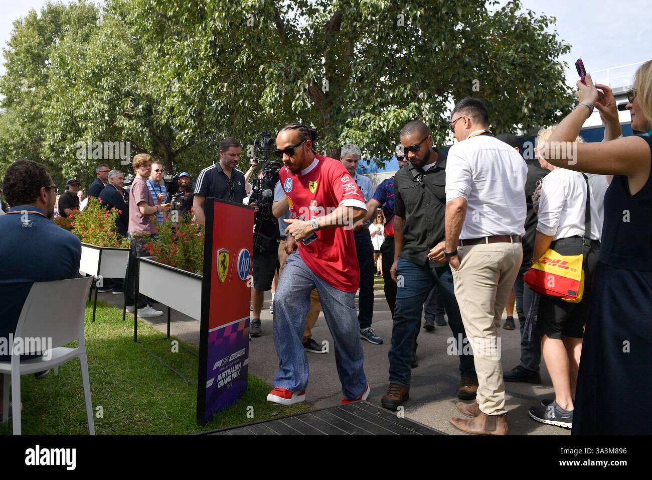 Ferrari Formula 1 driver Lewis Hamilton dashes to escape attention of ...