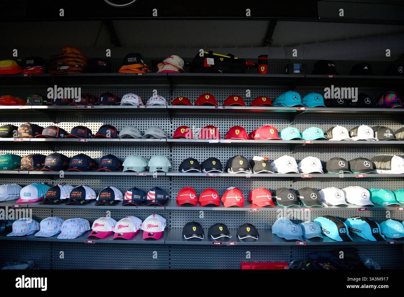 Formula One, Ferrari caps, Mercedes caps, Red Bull caps, on shelf ...