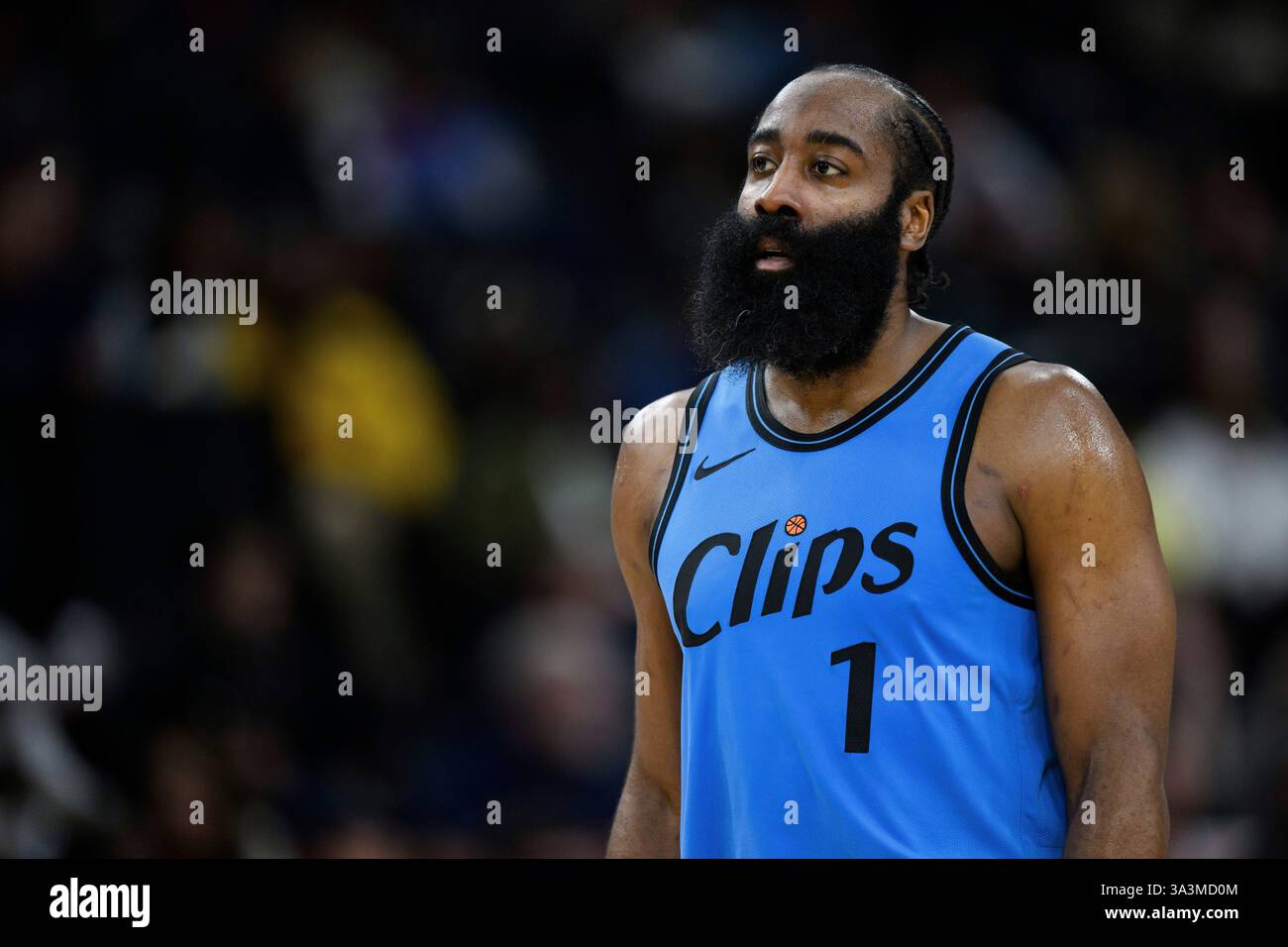 Los Angeles Clippers guard James Harden walks down the court during the ...