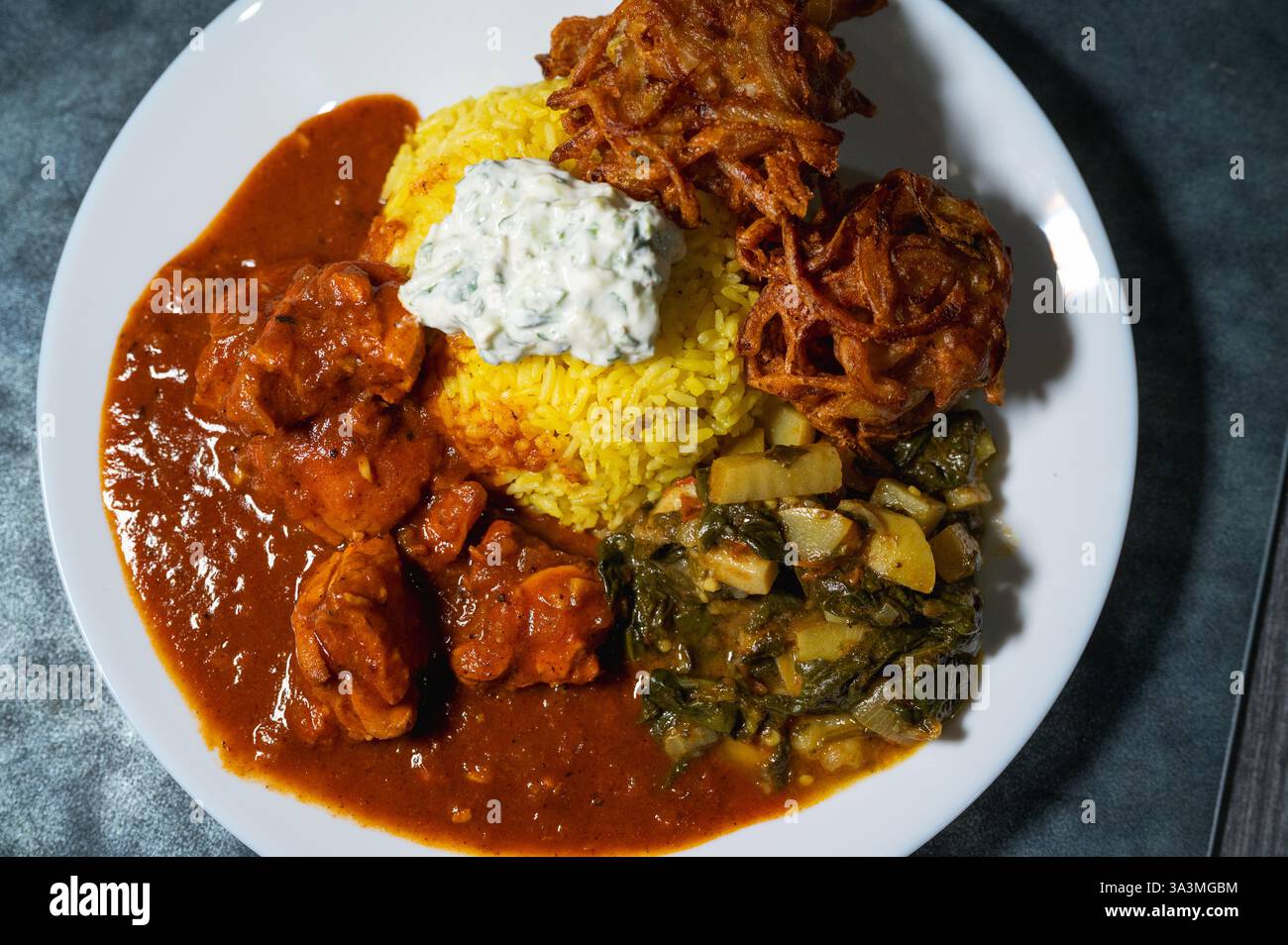 Indian butter chicken, also known as Murgh Makhani. Colorful curry dish ...