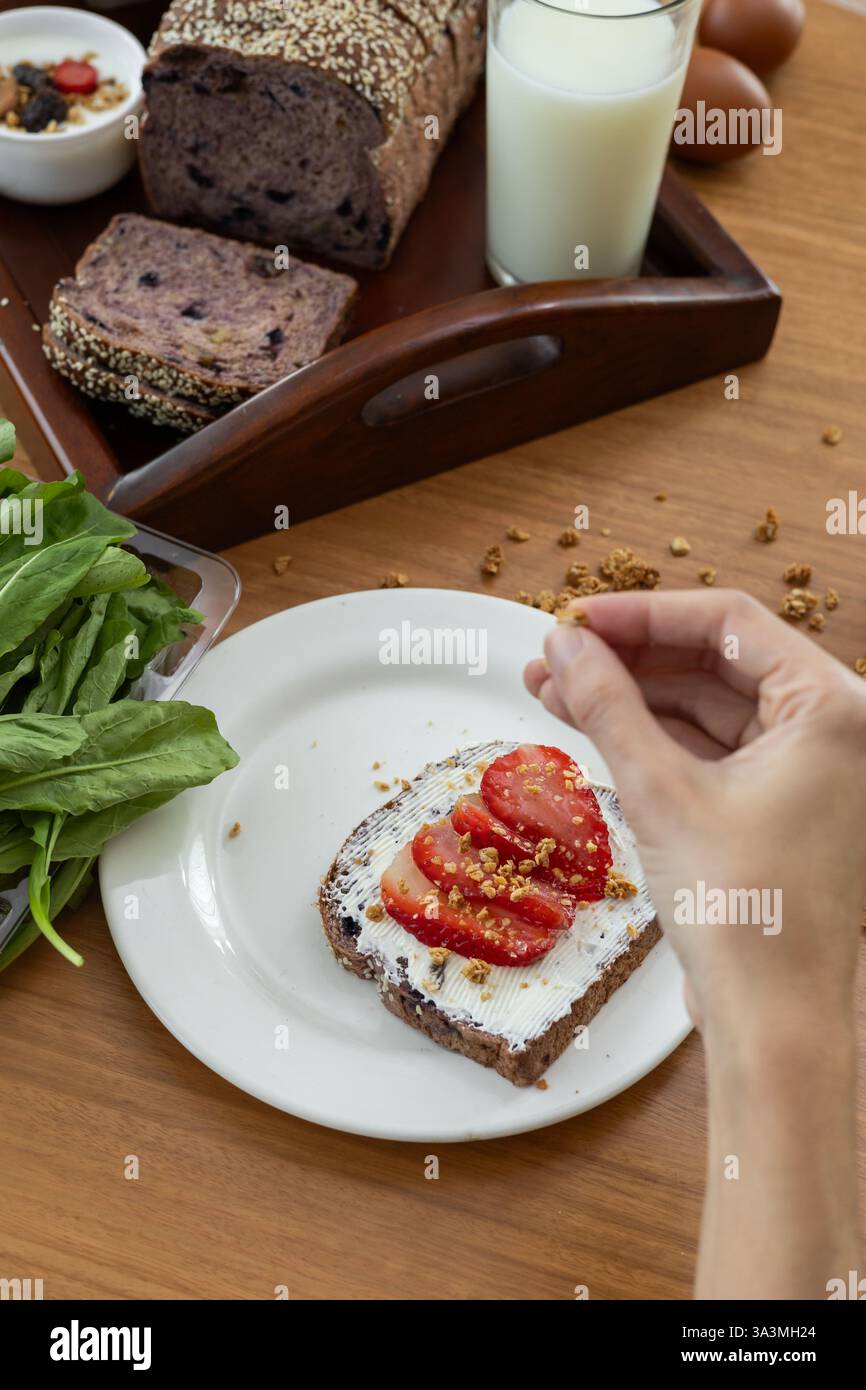 A deliciously simple toast topped with creamy cheese, fresh tomato ...