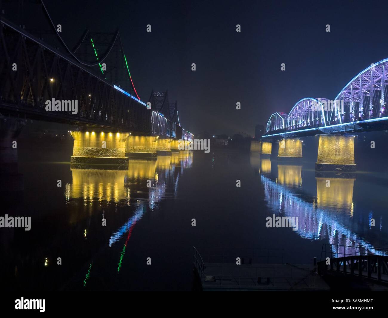The Yalu River Broken Bridge (right) is a historic railway swing bridge ...