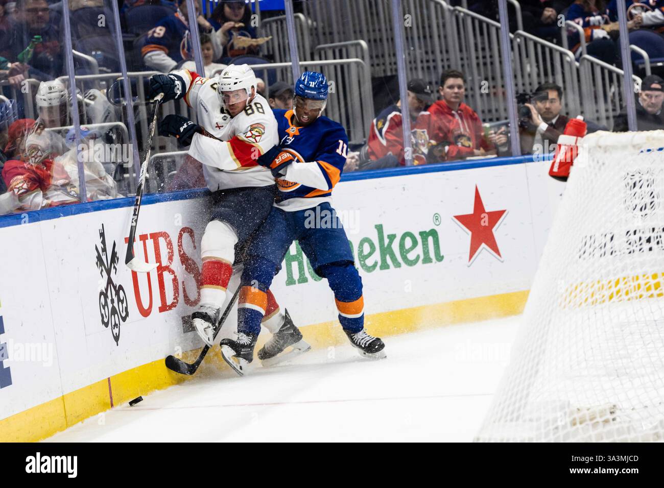 Florida Panthers defenseman Nate Schmidt (88) is slammed into the side ...